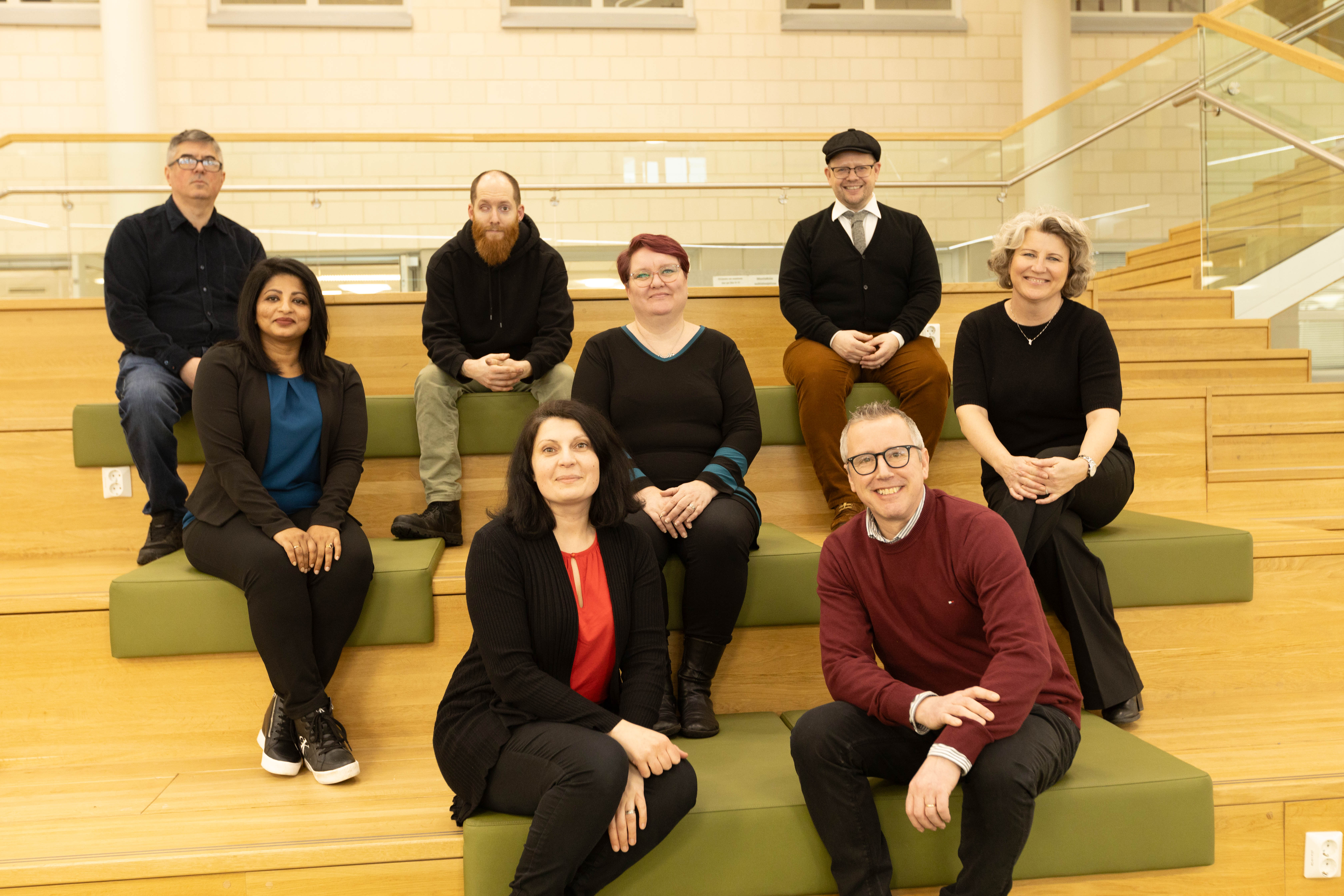 Team seated on steps – E-P WIISE ry